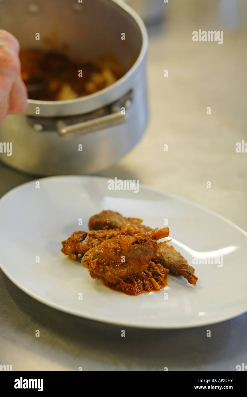 Preparing rabbit stew in Tuscan restaurant, Italy Stock Photo - Alamy