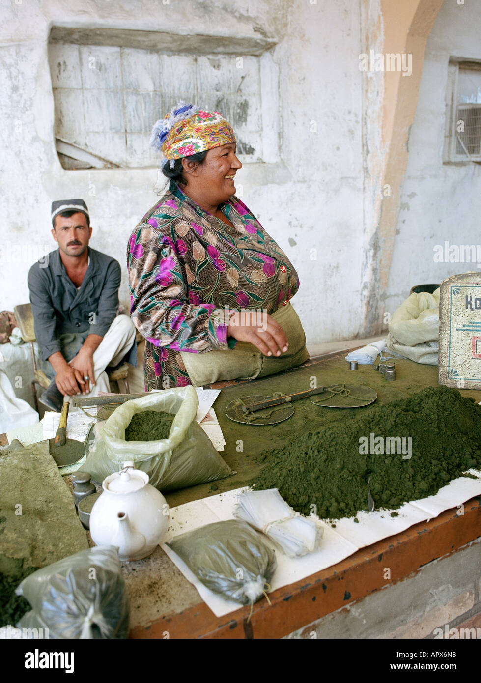 Market saleswoman selling tobacco, Market, Silk Road, Uzbekistan Stock ...
