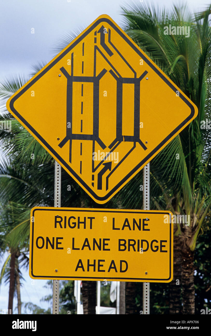 A road sign depicting two bridges ahead in Hawaii Stock Photo - Alamy