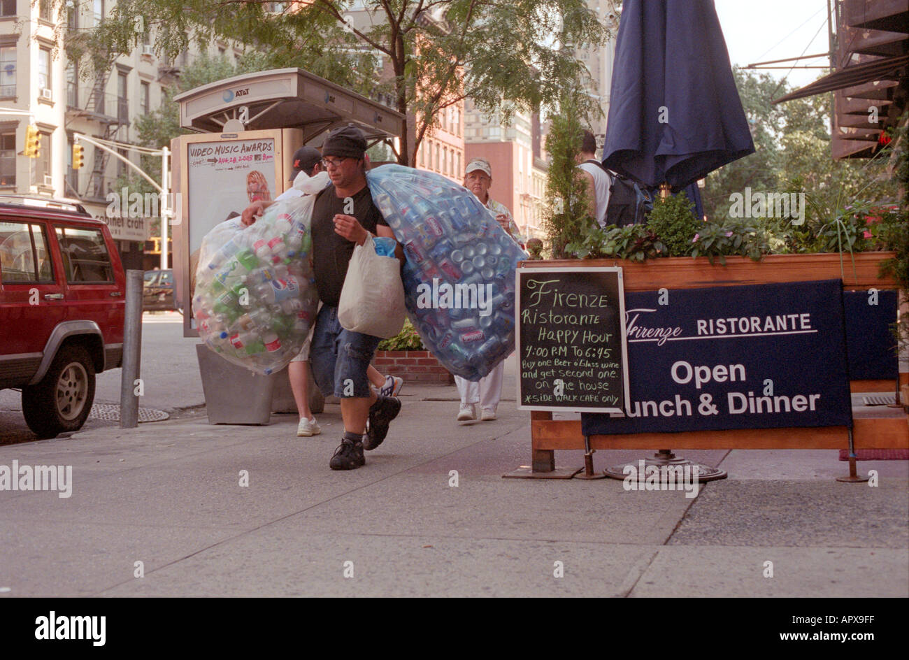 Homeless collecting cans street hi-res stock photography and images - Alamy
