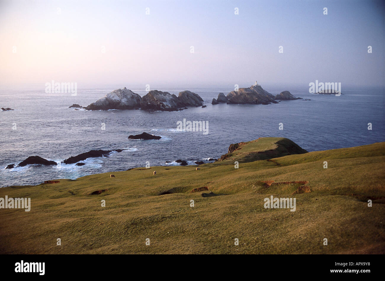 Muckle Flugge rocks, Lighthouse, Unst, Shetland Scotland Stock Photo ...
