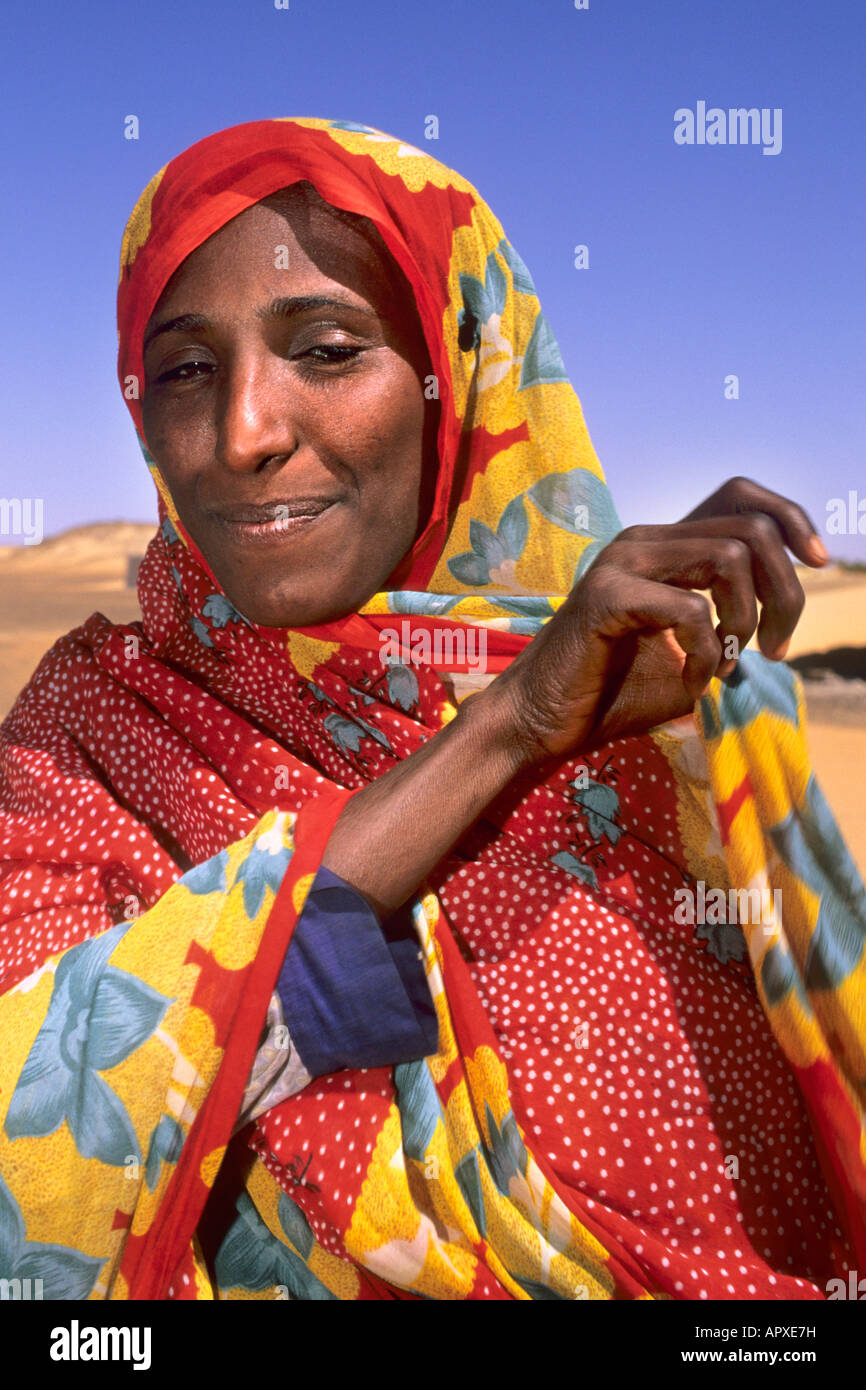 Portrait of Young Nubian woman in a red and yellow patterned dress ...