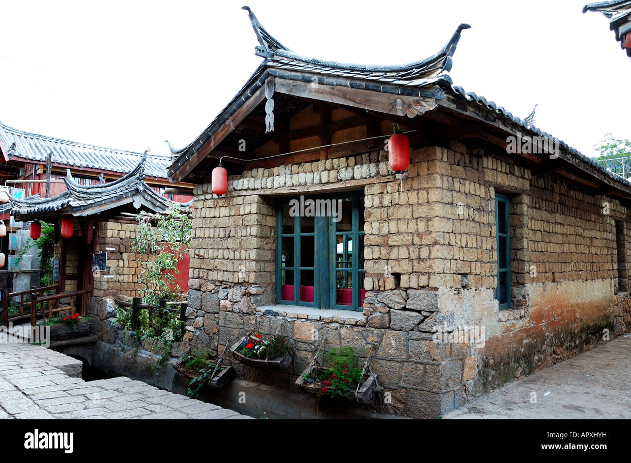 A traditional mud brick house in Lijiang, Yunnan, China Stock Photo - Alamy