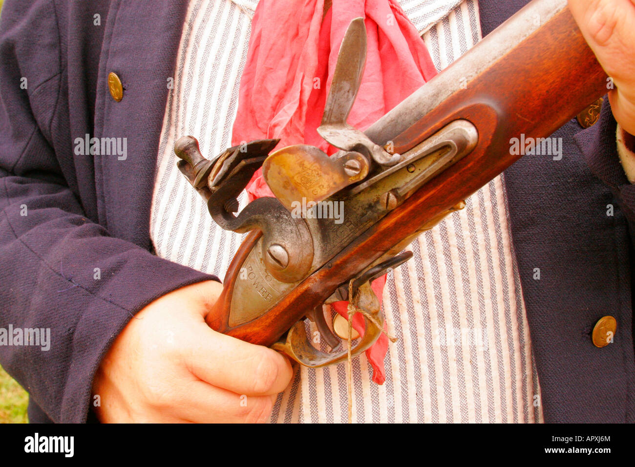 Musket in hands of American Naval seaman, War of 1812 Reenactment ...