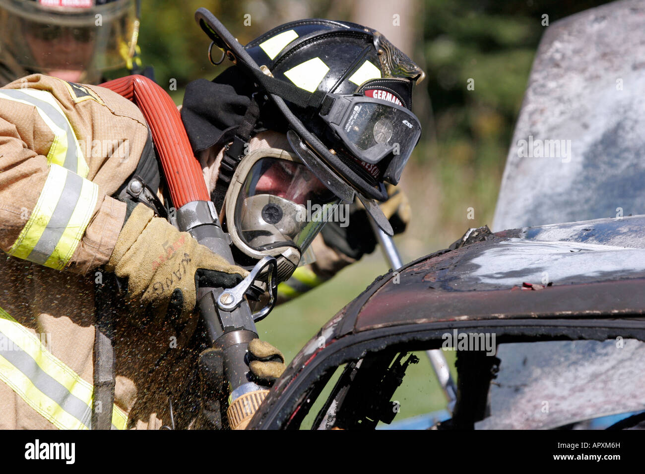 Two Germantown Wisconsin Firefighters putting out a car fire at an ...