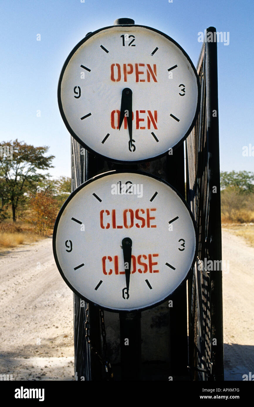 The opening and closing times of the park displayed at the entrance to ...