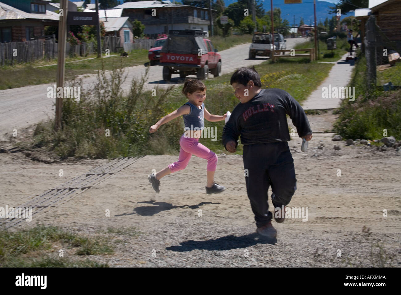 Children playing tag Puerto Guadal Patagonia Chile Stock Photo - Alamy