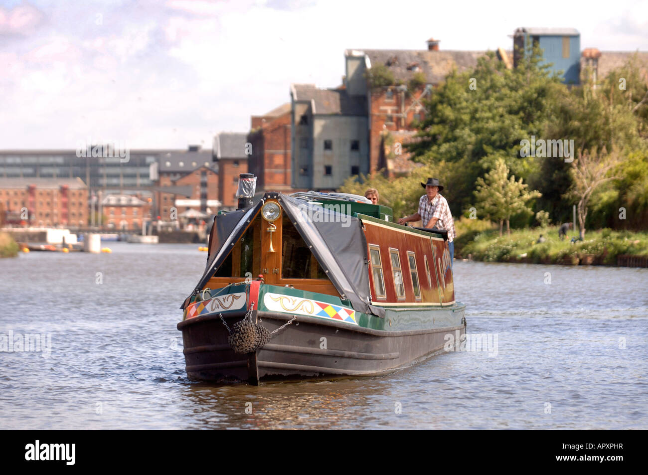 A COUPLE ON A POLISH BUILT NARROWBOAT AT MONK MEADOW DOCK IN GLOUCESTER ...