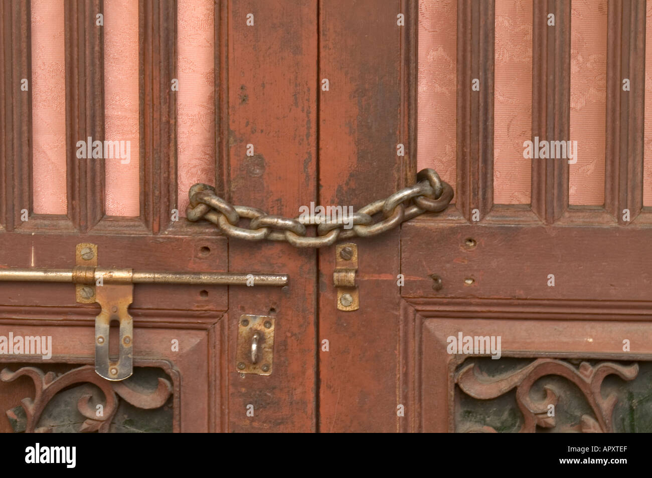 Chained locked door Malaysia Stock Photo - Alamy