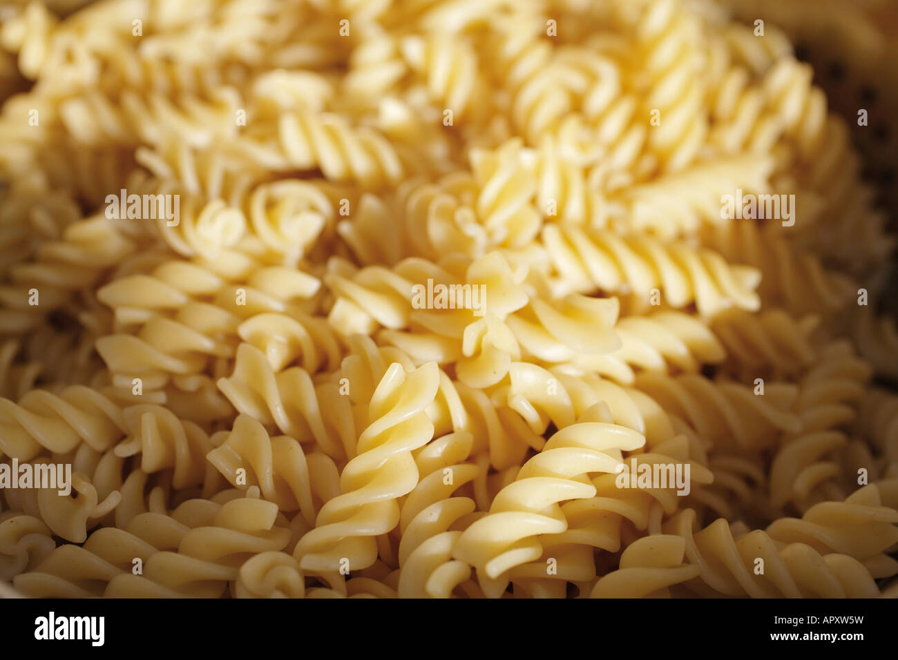 Spiral noodles full frame Stock Photo - Alamy