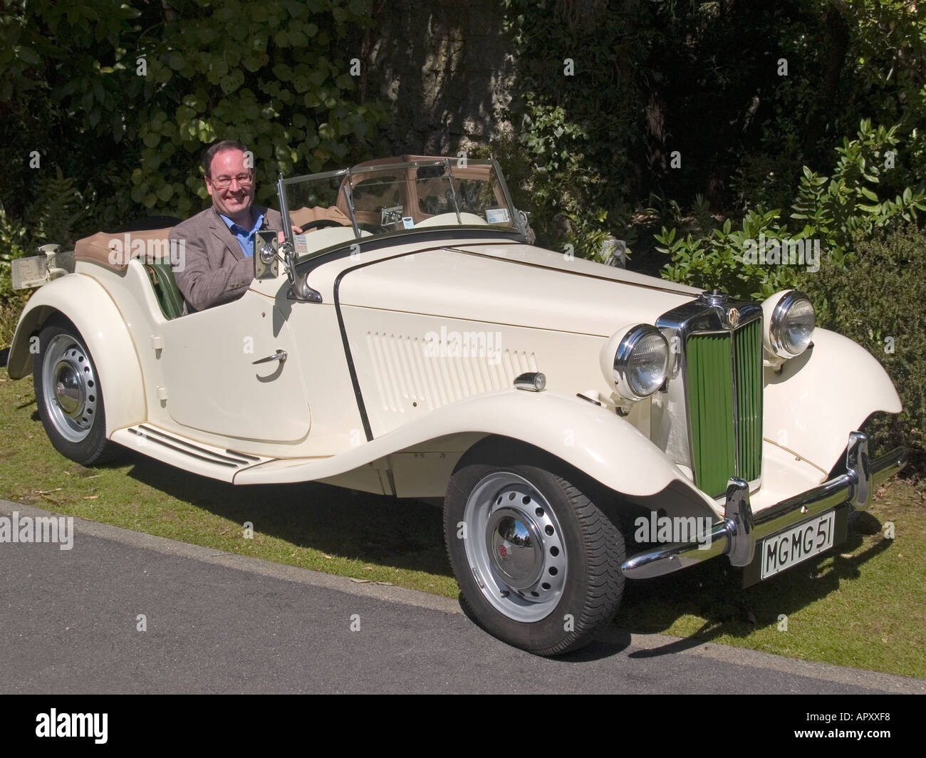White MG 1951 classic British sports car with male driver Stock Photo ...