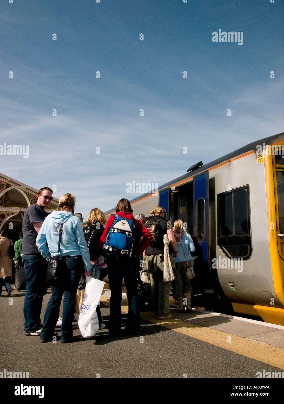 Passengers boarding a train at Aberystwyth railway station, wales UK ...