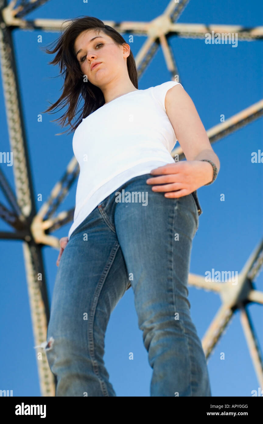 Young woman standing in a bridge Stock Photo - Alamy