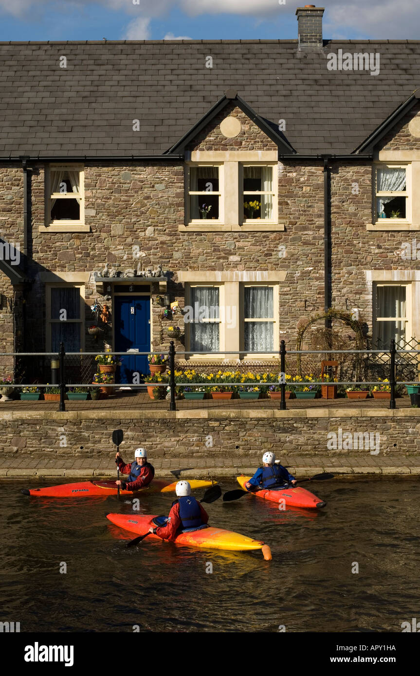Two young teenage canoeists with instructor learning how to canoe ...