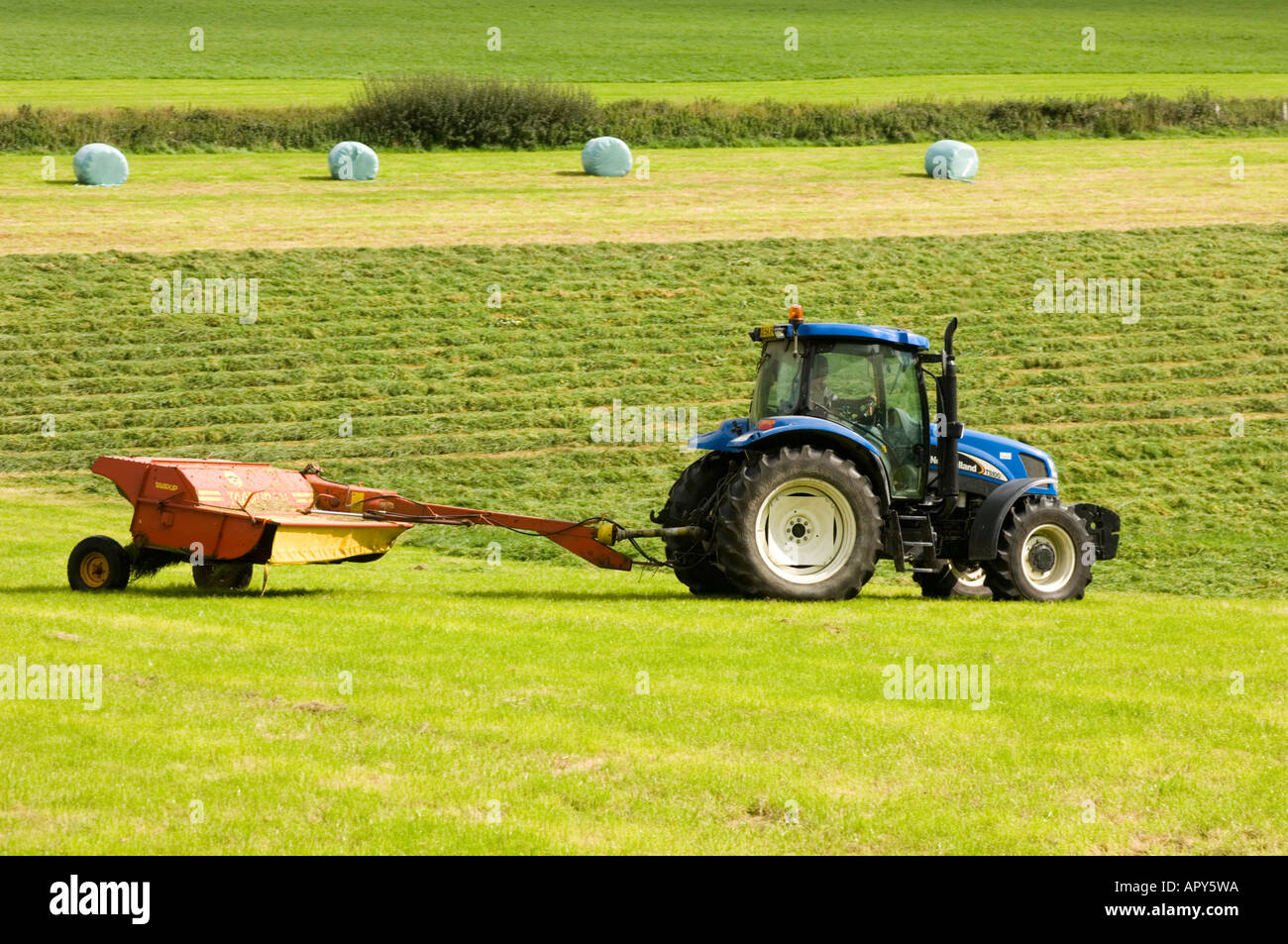 Tractor cutting grass hi-res stock photography and images - Alamy