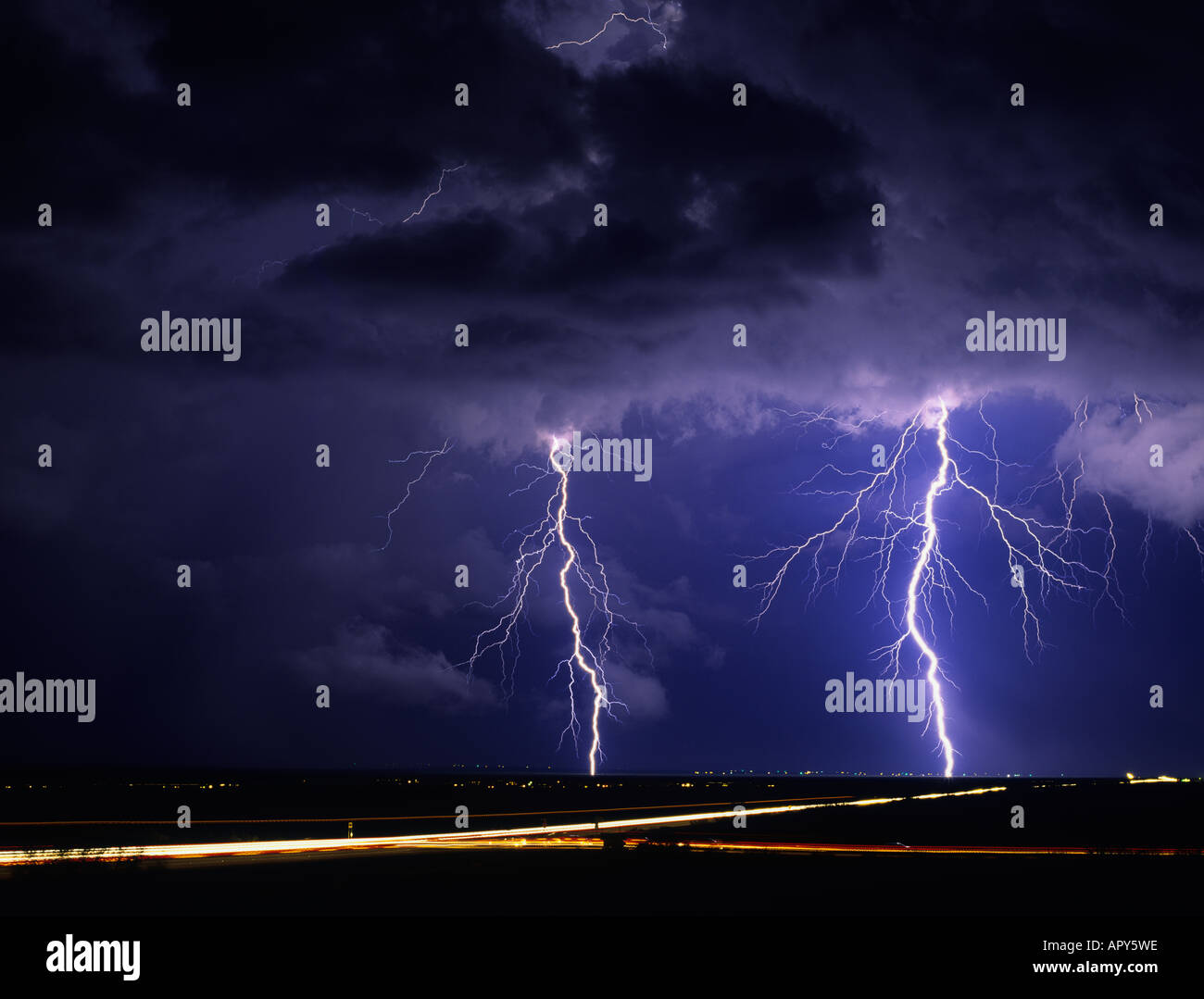 Distant lightning bolts strike during a summer monsoon storm in ...