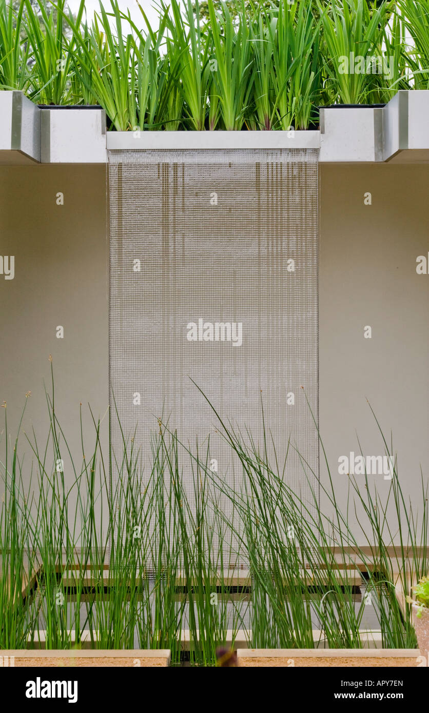 Cascade waterfall on metal grid with stainless steel facade, including ...