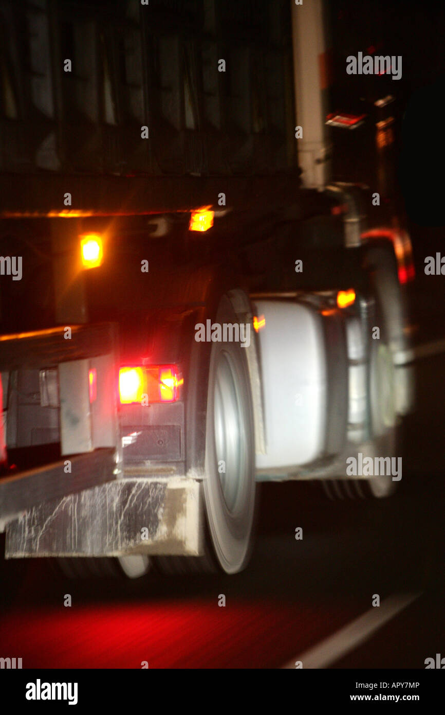 HGV Lorry on motorway at night Stock Photo - Alamy