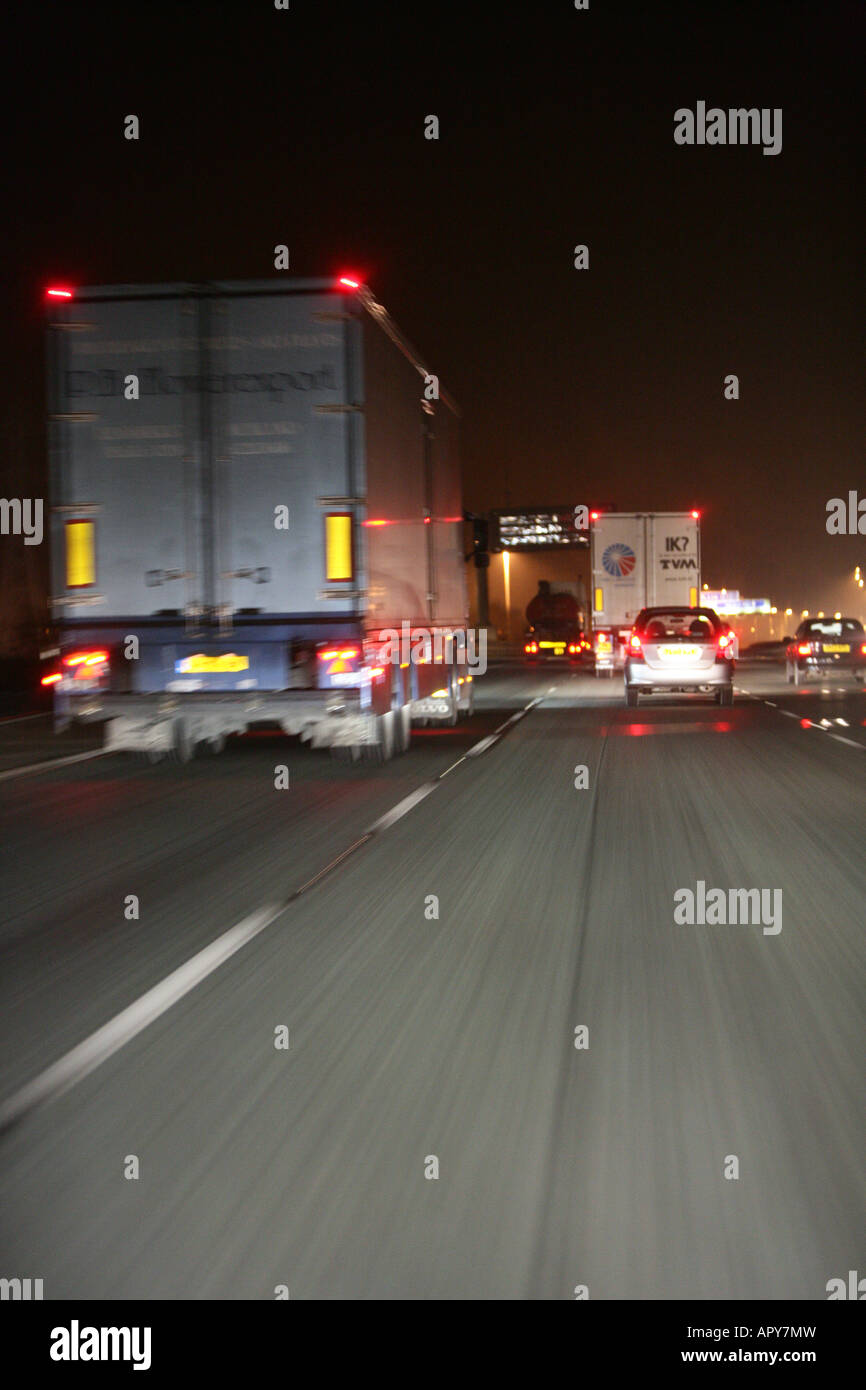 HGV Lorry on motorway at night Stock Photo - Alamy