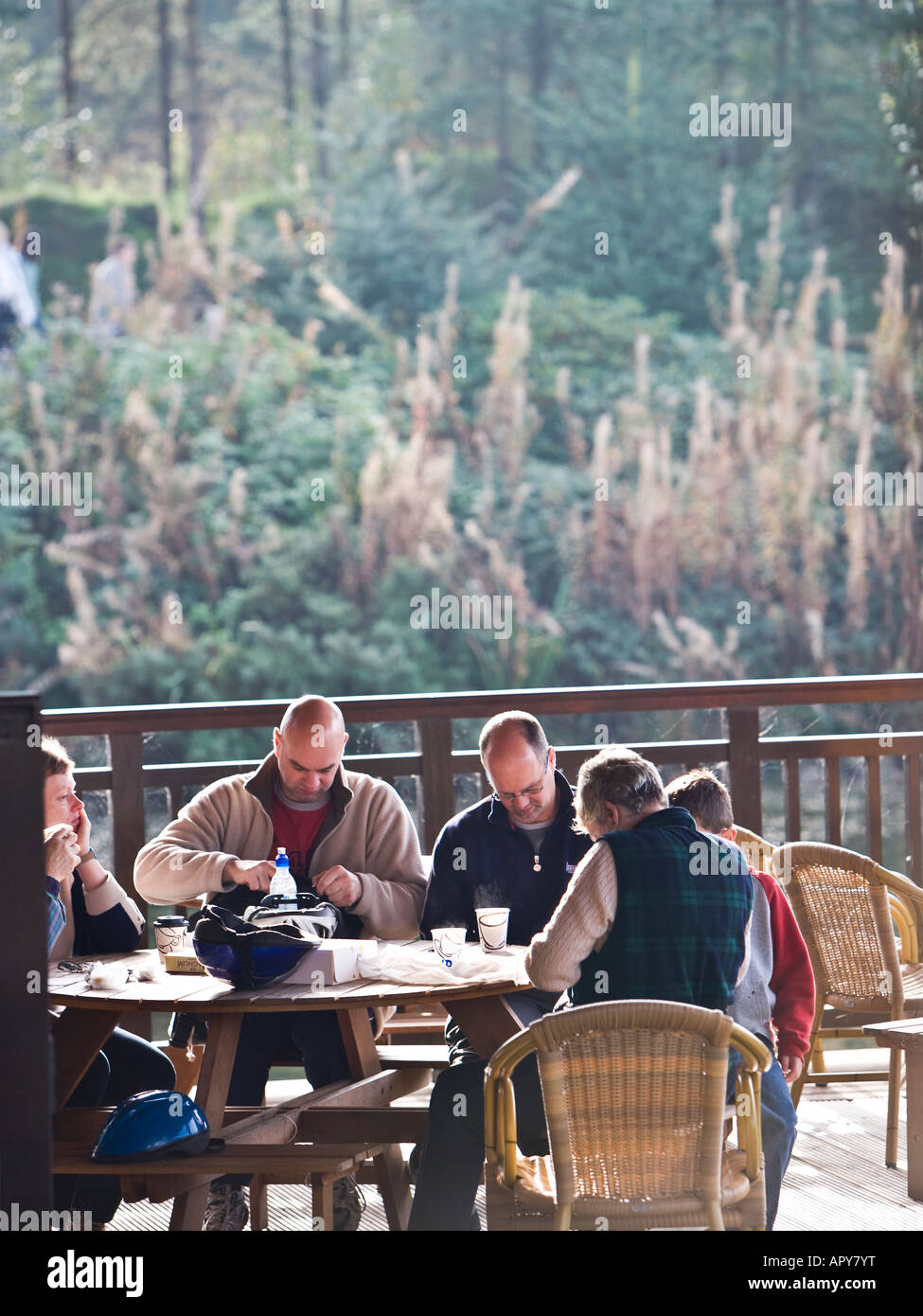 Family Socialising in Cafe Stock Photo - Alamy