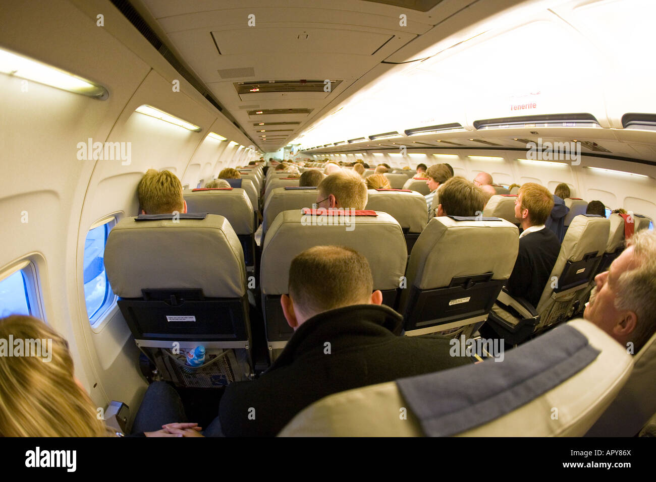 Civil aviation jet aeroplane flying cabin passengers Stock Photo - Alamy