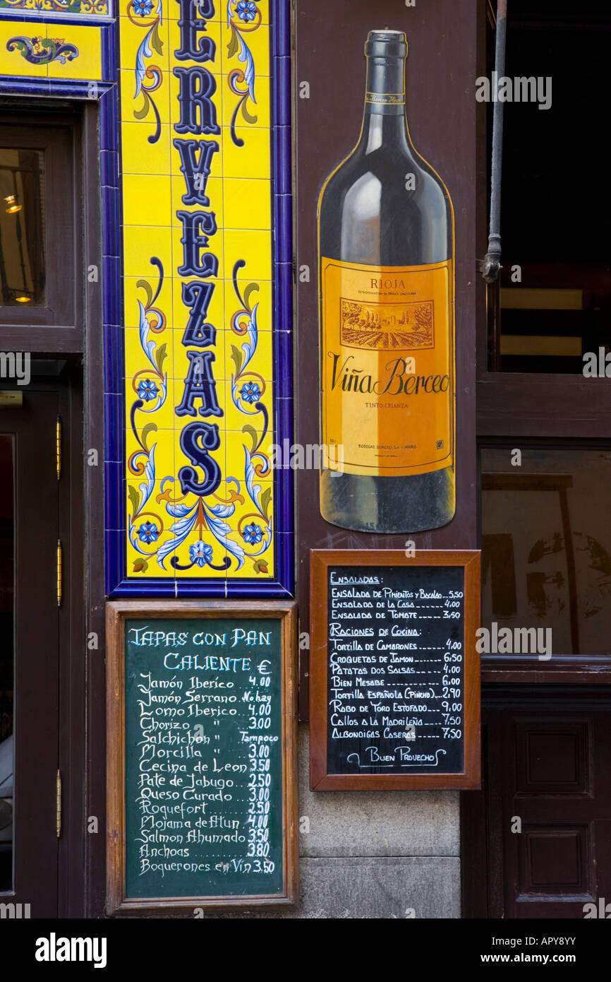 Madrid, Spain. Menu boards and tilework on wall of traditional tavern ...