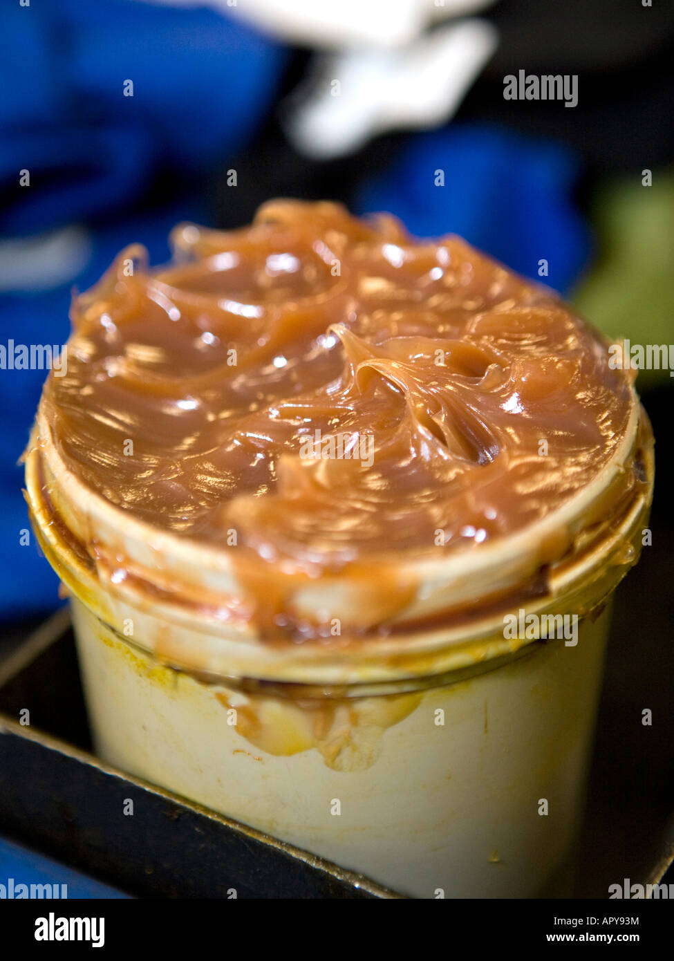 Tub of grease in factory Stock Photo - Alamy