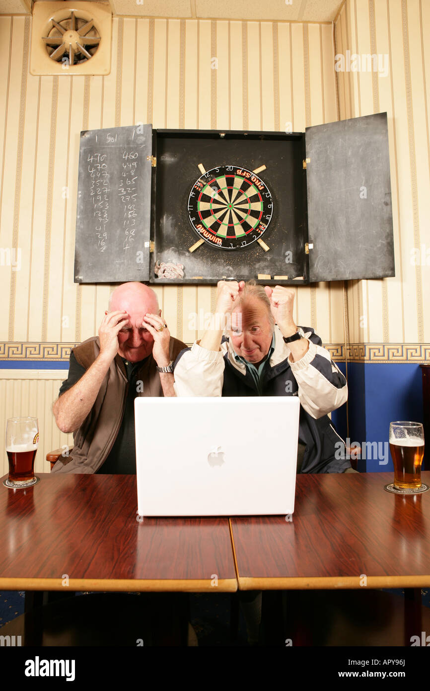 Old people men using new technology in local working mans club pub ...