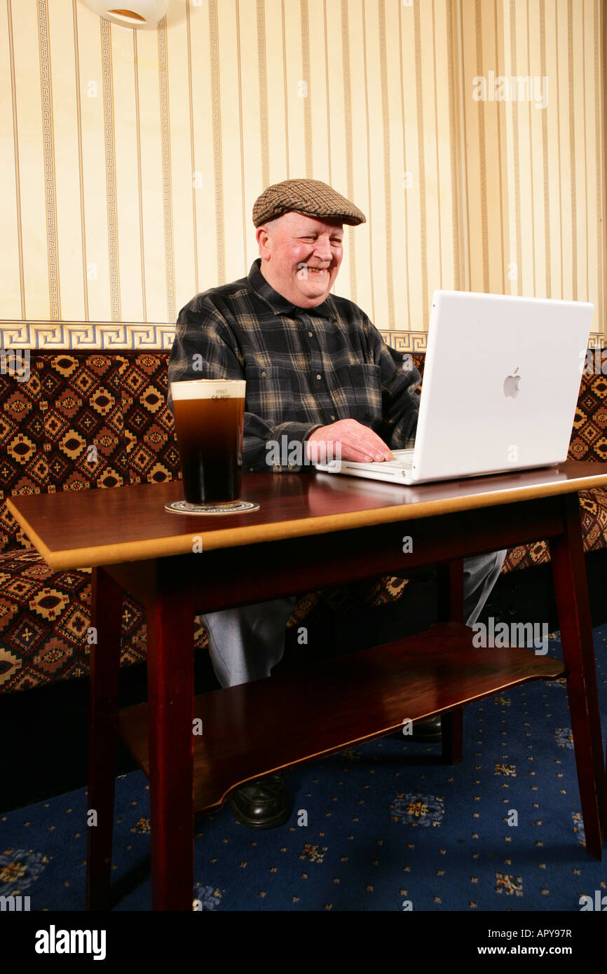 Old people men using new technology in local working mans club pub ...