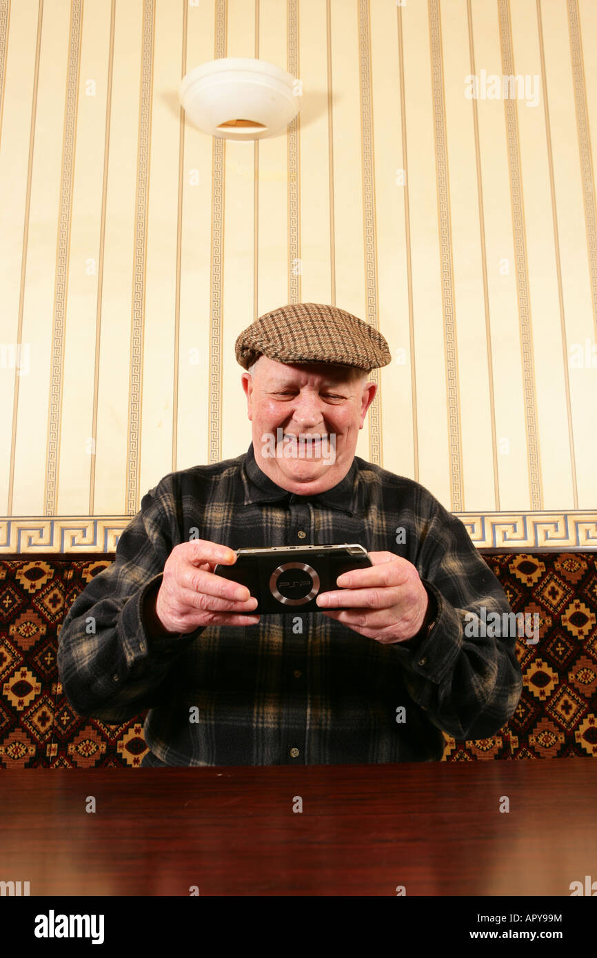 Old people men using new technology in local working mans club pub ...