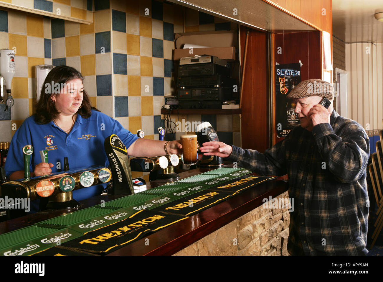 Old people men using new technology in local working mans club pub with ...