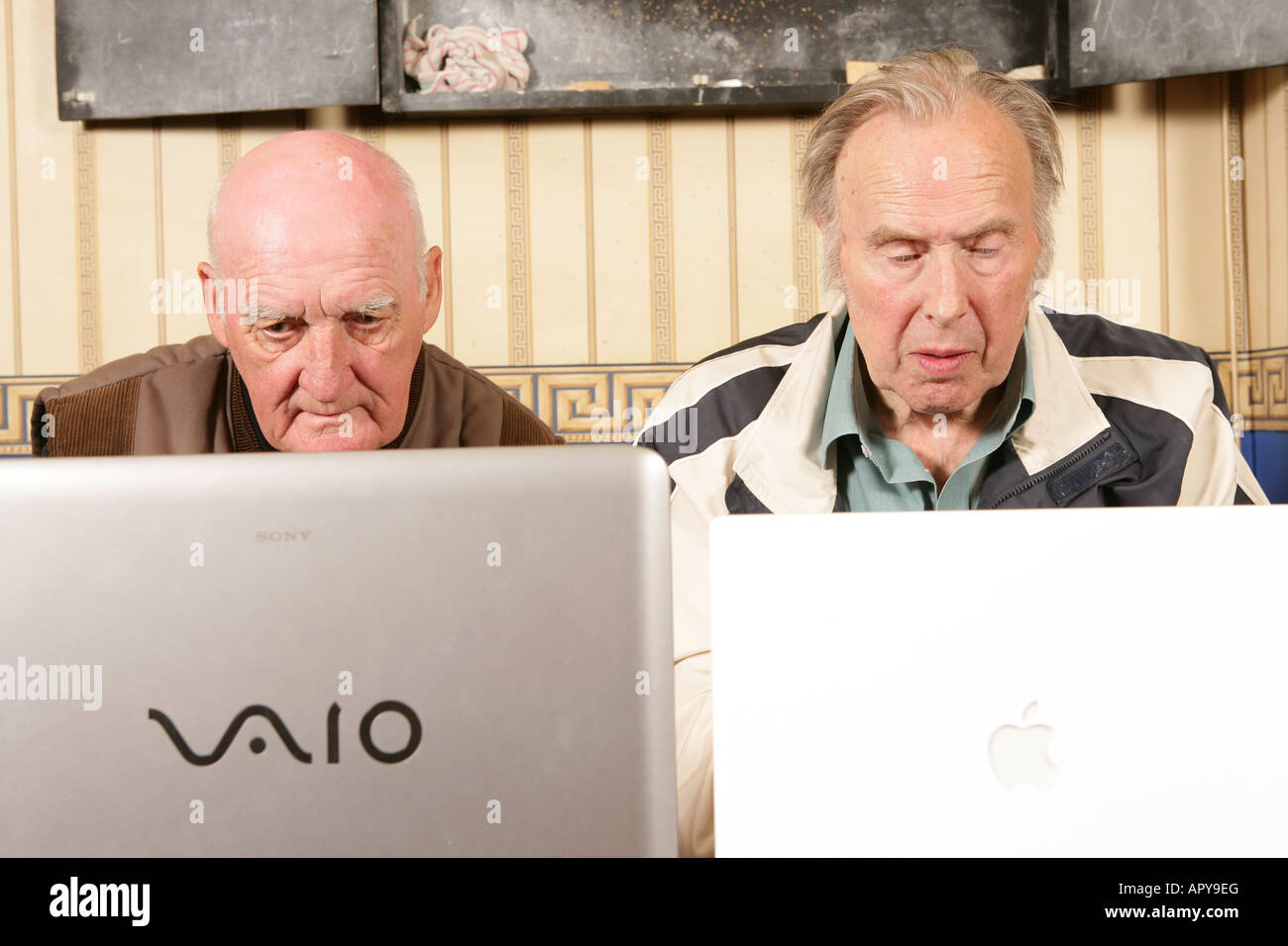 Old people men using new technology in local working mans club pub ...