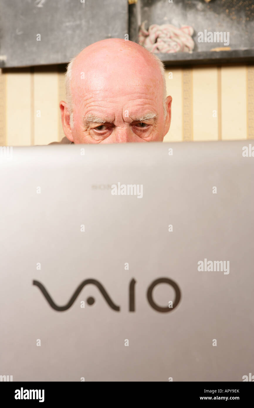 Old people men using new technology in local working mans club pub ...