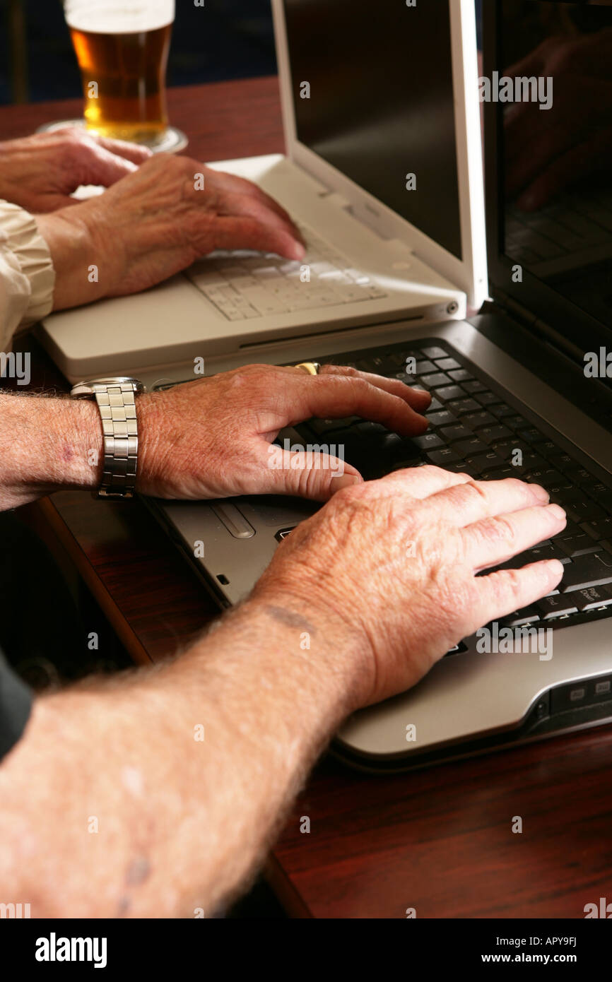 Old people men using new technology in local working mans club pub ...