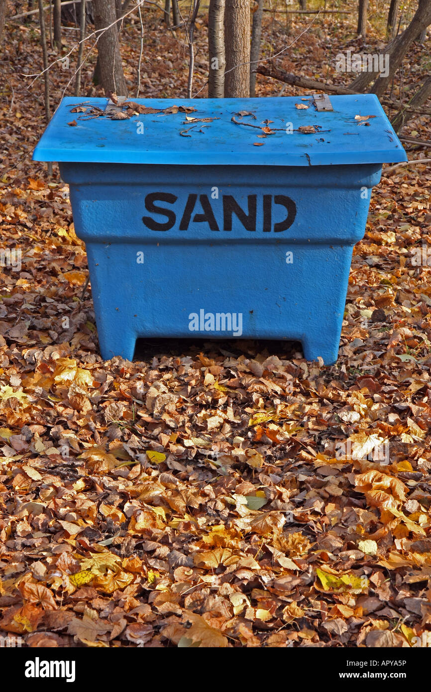 Blue box with the letters sand on it. Filled with sand to use on ice ...