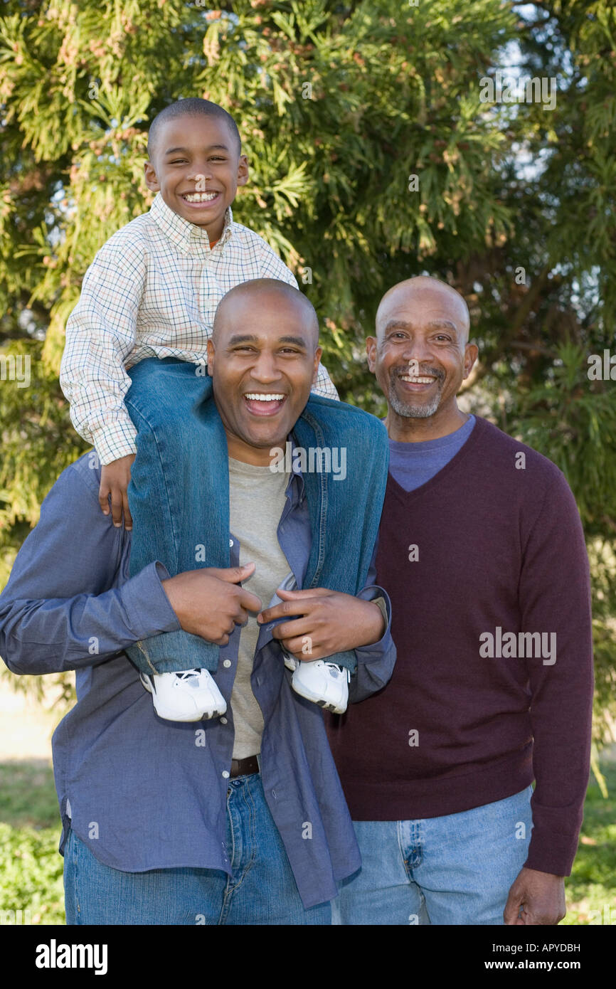 African grandfather, father and son in park Stock Photo - Alamy