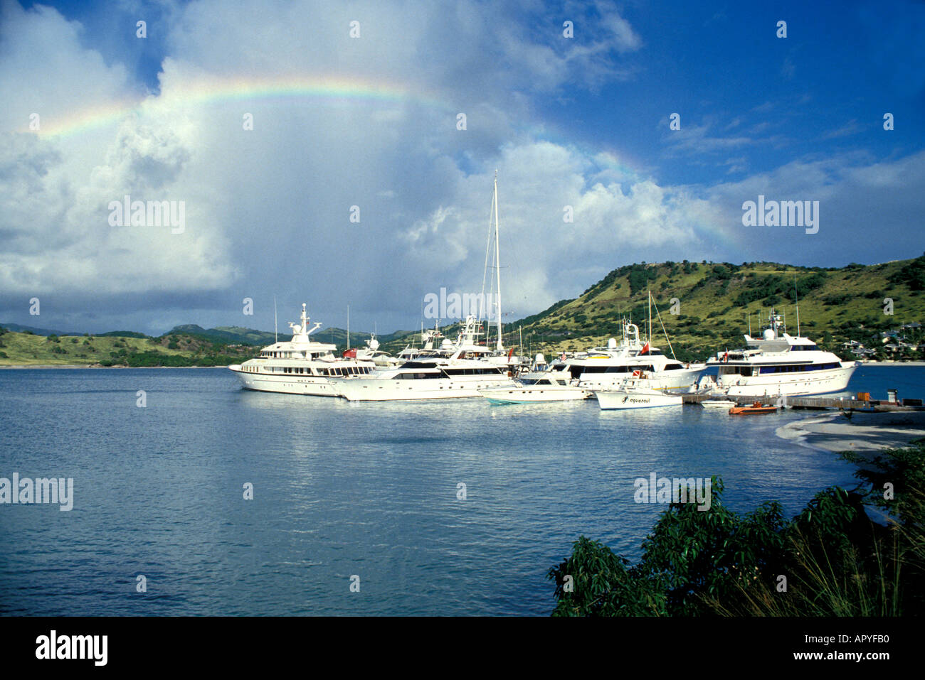 Antigua Luxury Powerboats at Anchor with Rainbow overhead Stock Photo ...