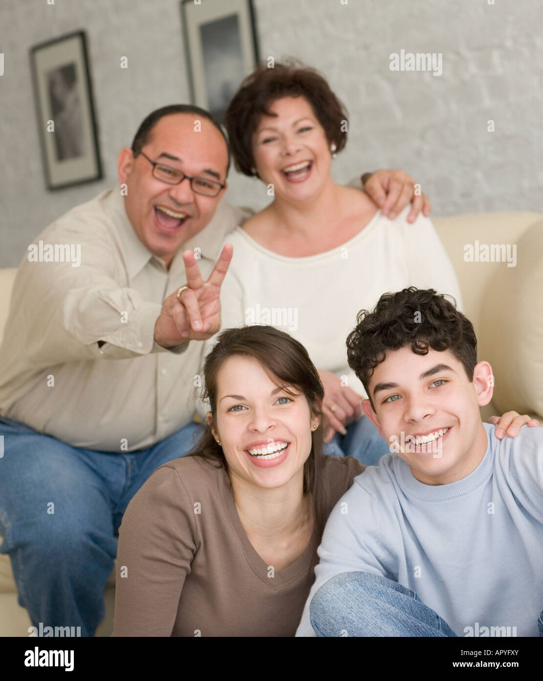 Portrait of Hispanic family being silly Stock Photo - Alamy