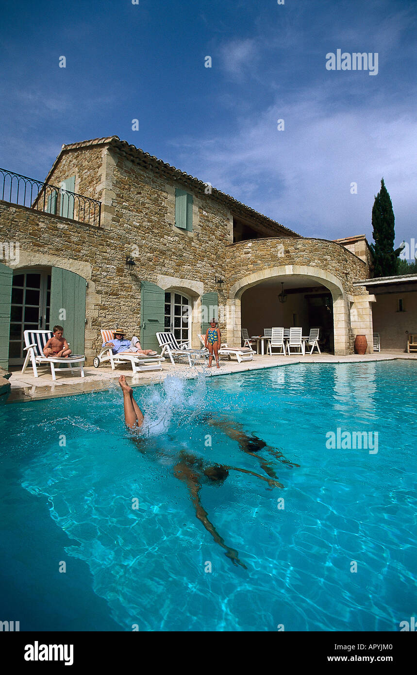 Group of people jumping into pool hi-res stock photography and images ...