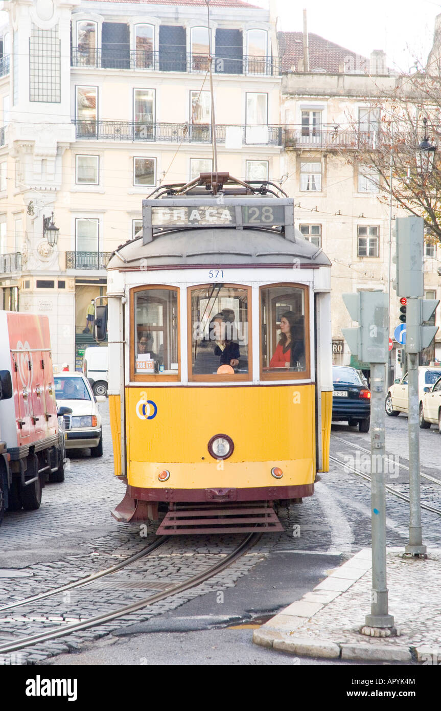 Historic yellow tram in a steep street in lisbon hi-res stock ...
