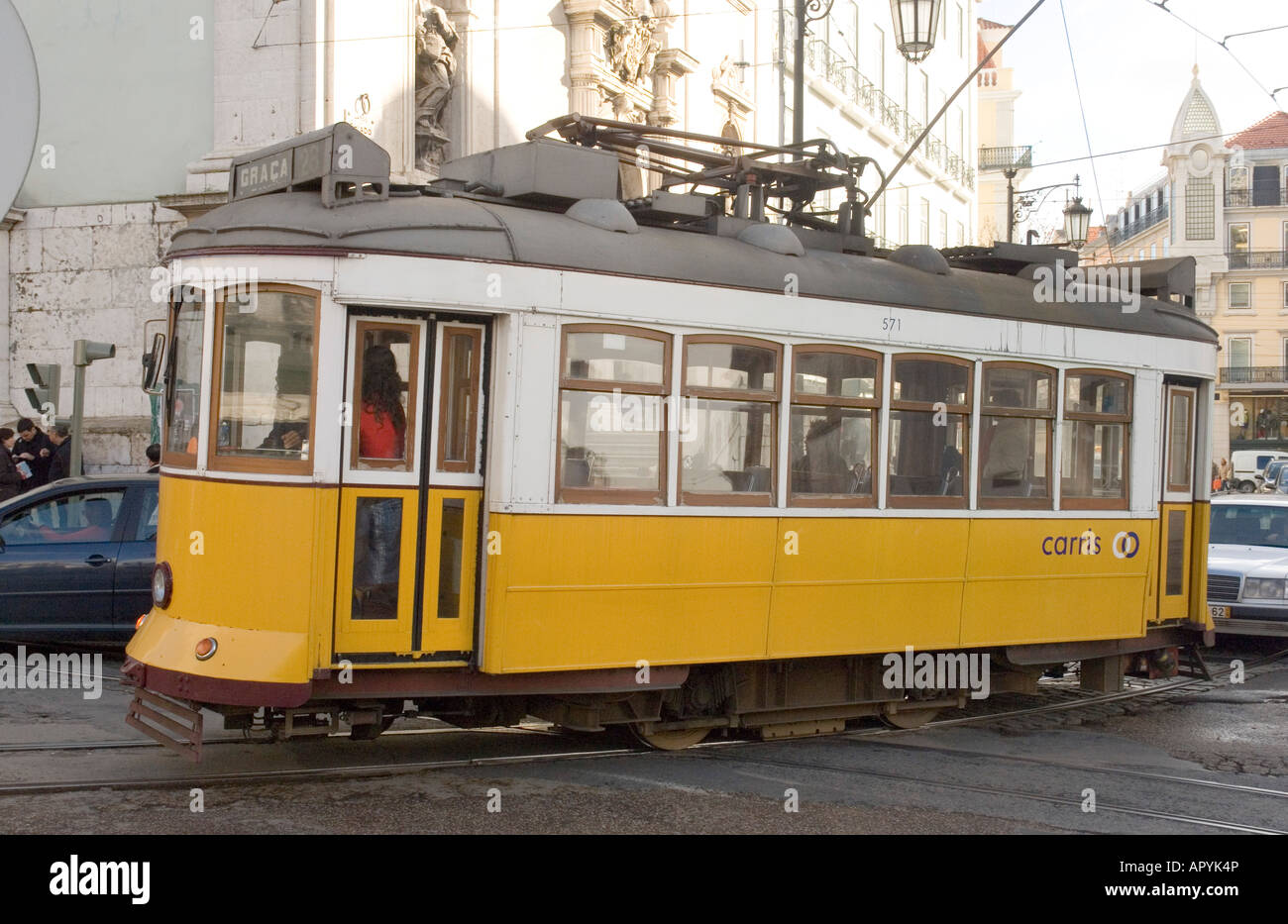 Historic yellow tram in a steep street in lisbon hi-res stock ...