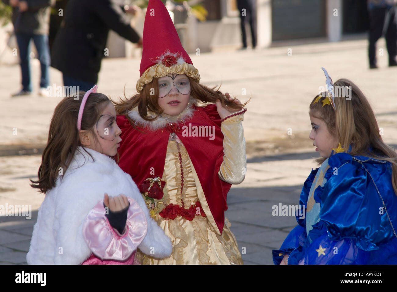 Three young girls in hats and costumes at the carnival, in Campo Santa ...