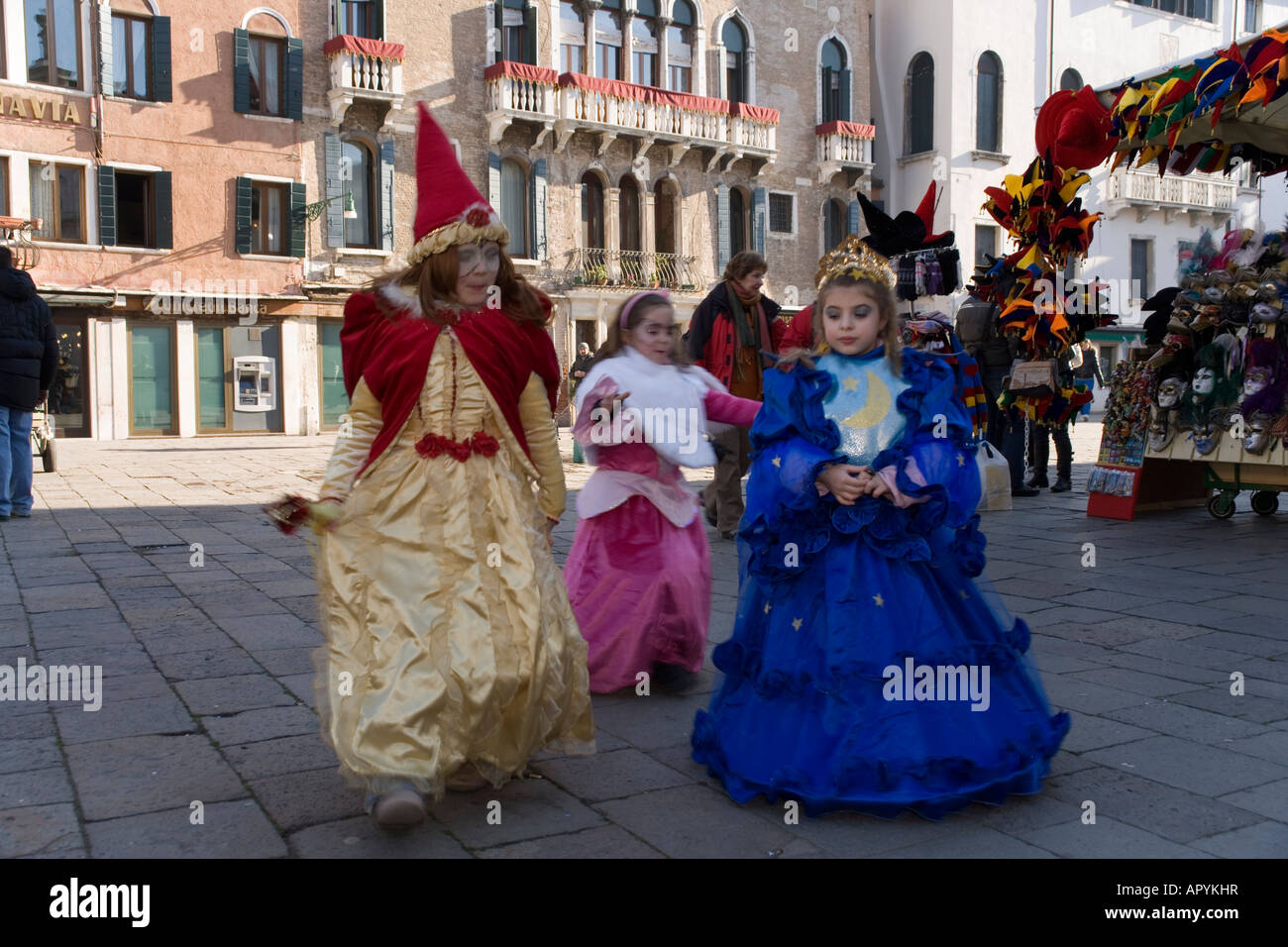 Three young girls in hats and costumes at the carnival, in Campo Santa ...