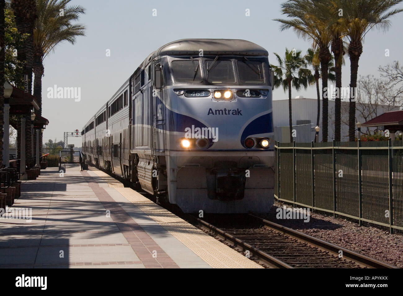 An Amtrak passenger train pulls into the station in Fullerton ...