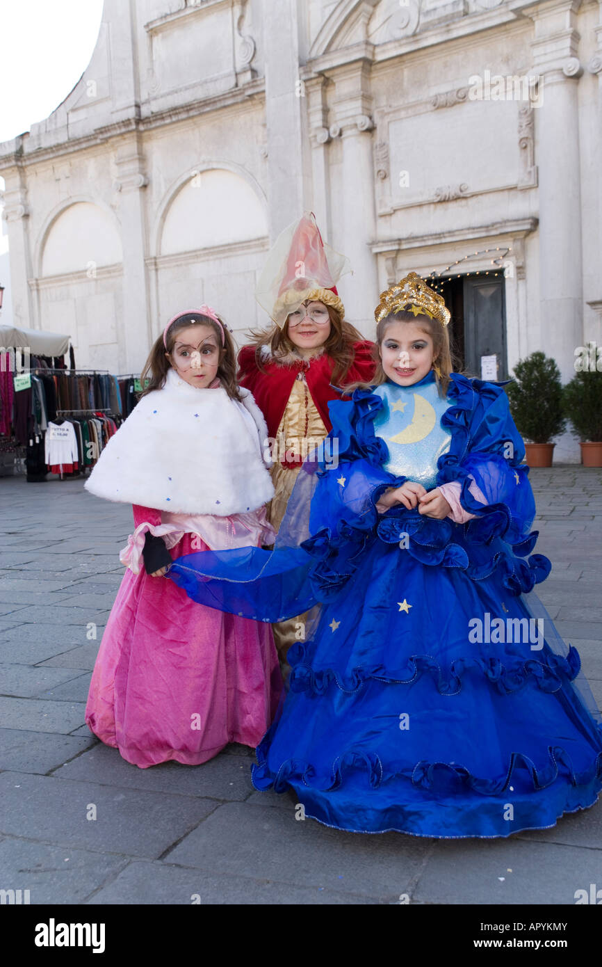Three young girls in hats and costumes at the carnival, in Campo Santa ...