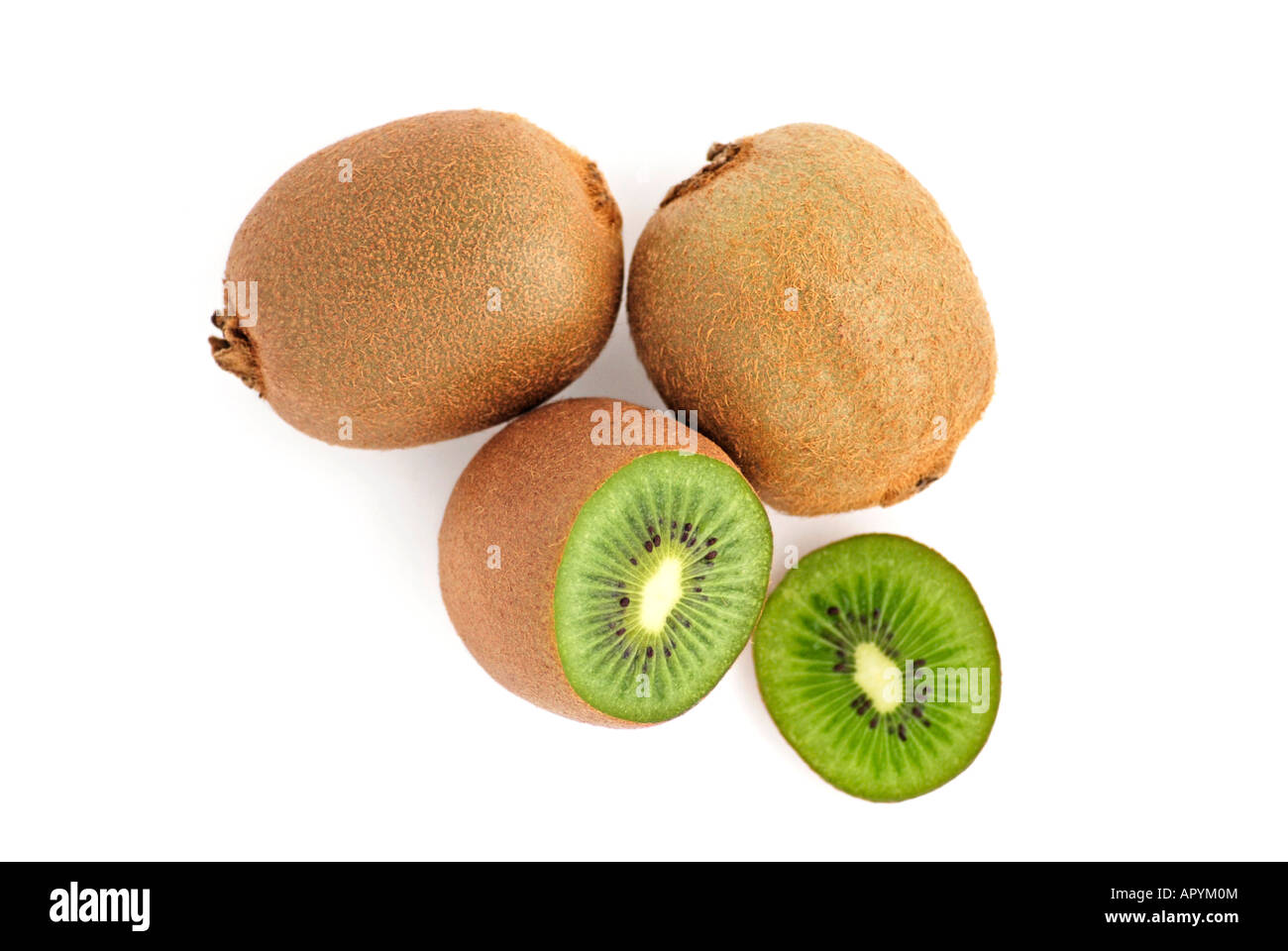 Two whole and one sliced Kiwi Stock Photo - Alamy