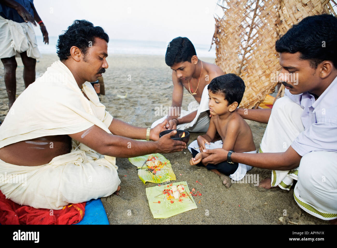INDIA KERALA VARKALA FAMILY MAKE DAILY PUJA Stock Photo - Alamy
