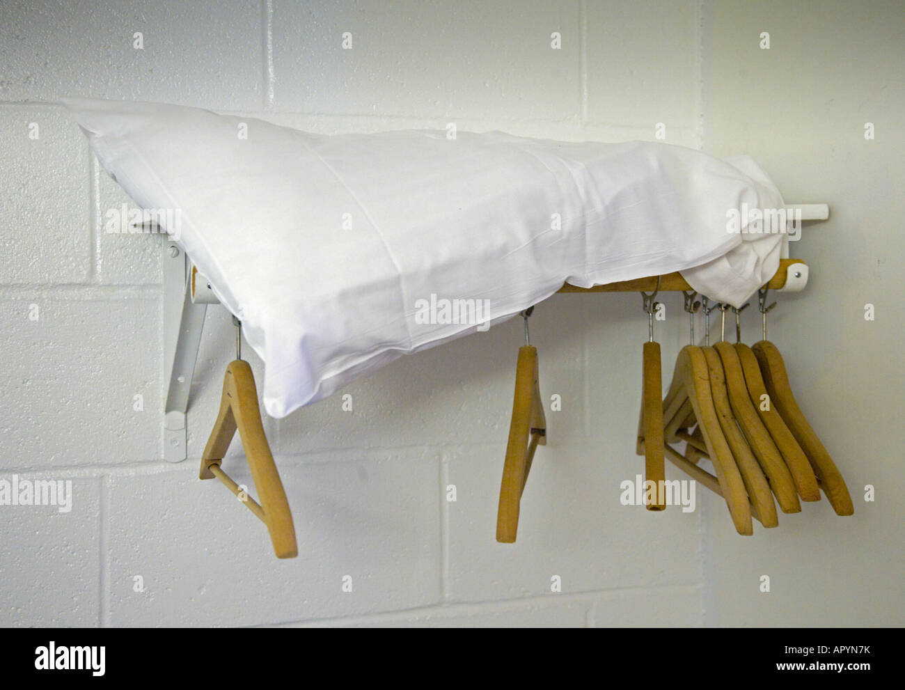 Pillow and hangers on a rack Stock Photo - Alamy