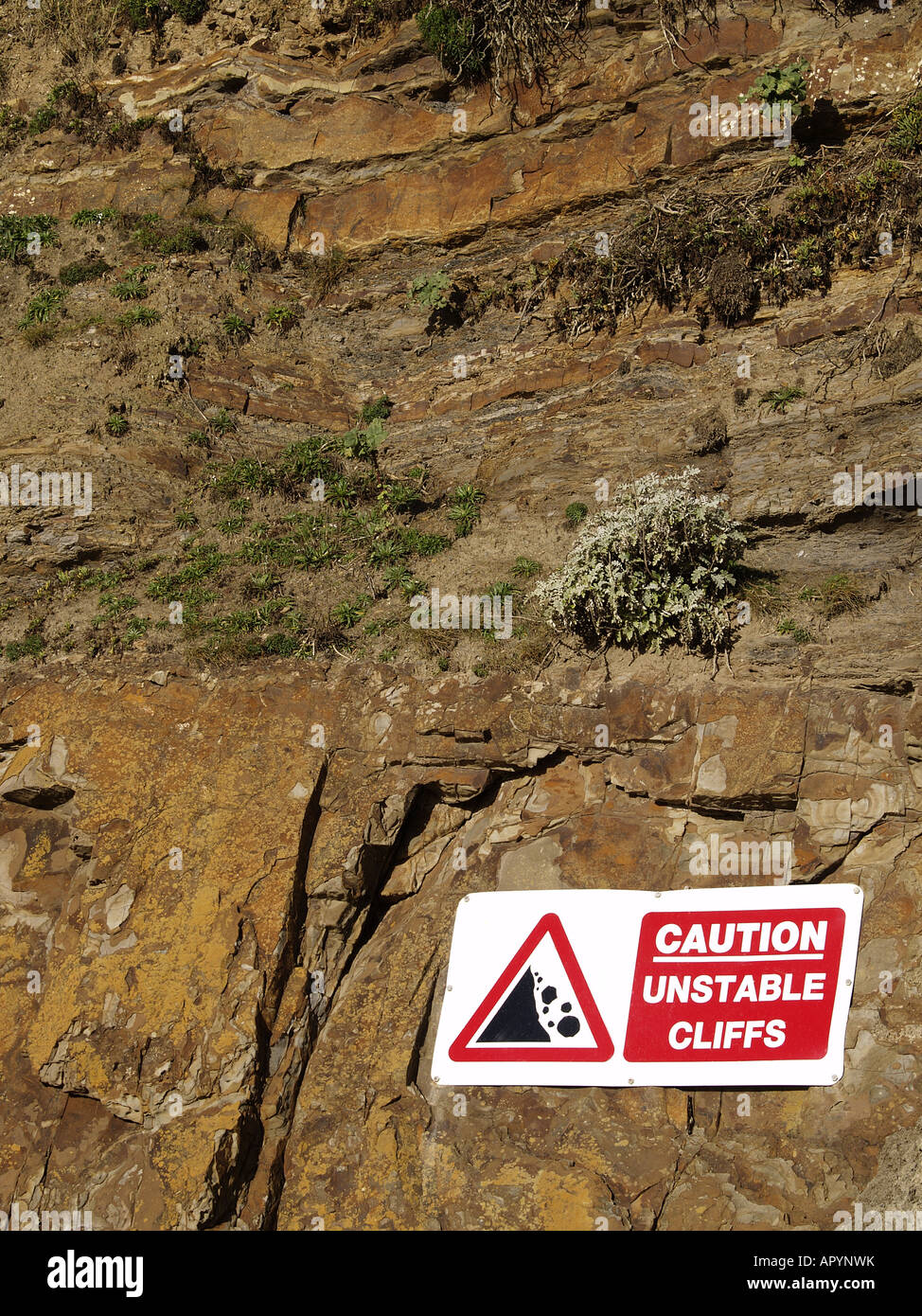 Cliff face with warning sign Stock Photo - Alamy