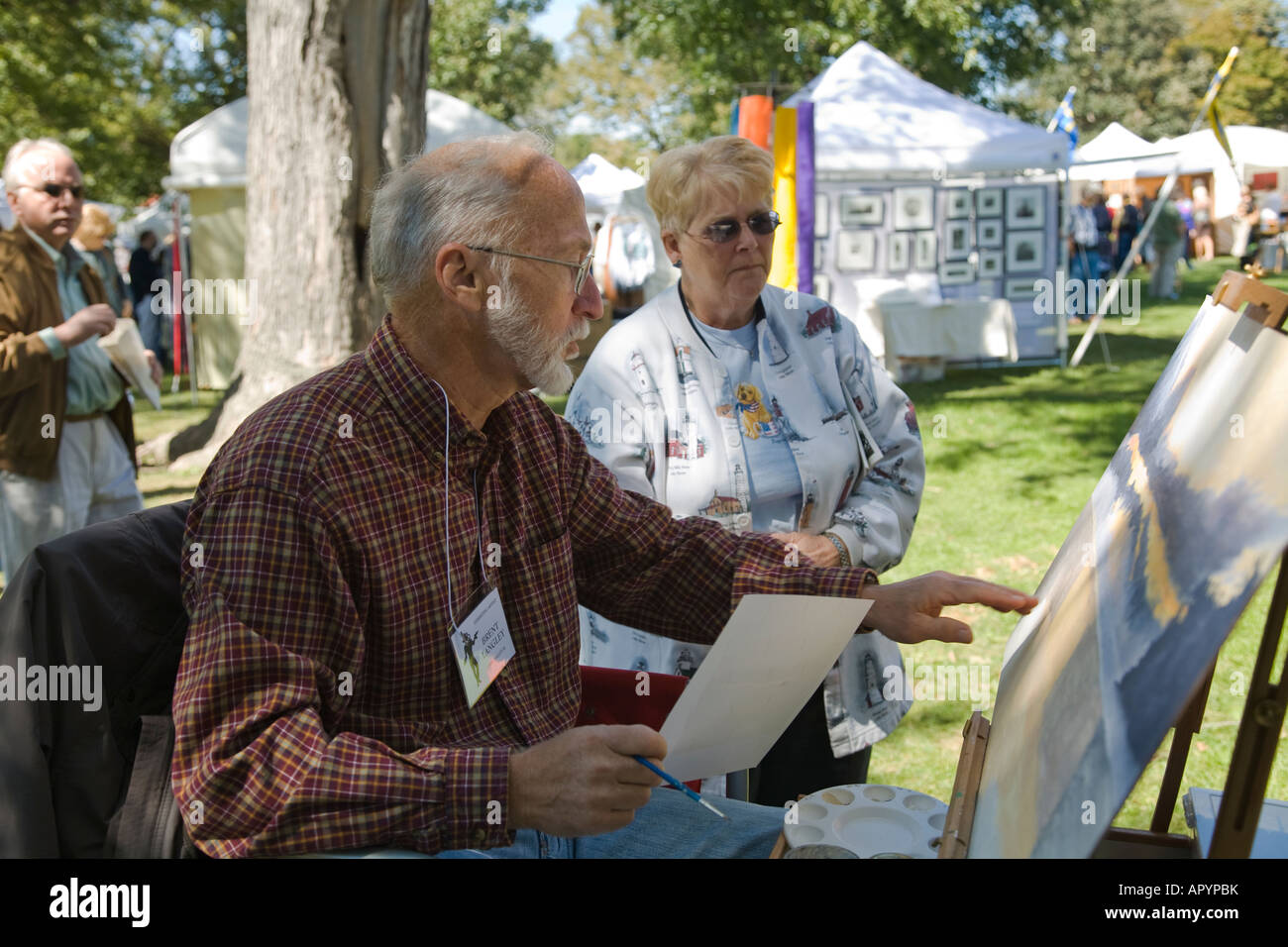 IOWA East Davenport Male artist discuss painting with woman Riverssance ...